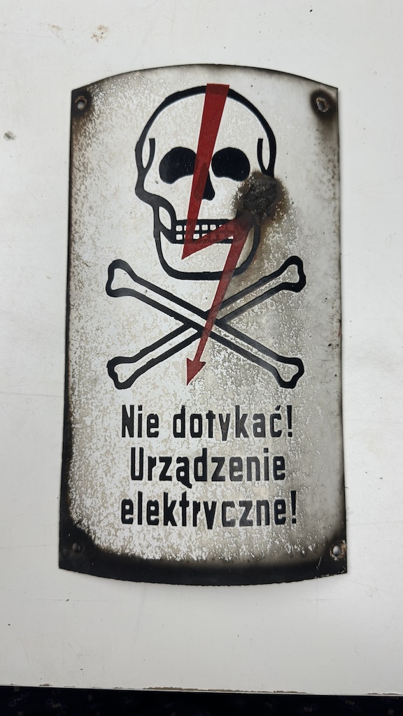 Concentration camp AUSCHWITZ BIRKENAU fences achtung minen skull metal sign