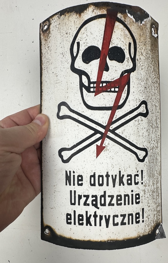 Concentration camp AUSCHWITZ BIRKENAU fences achtung minen skull metal sign