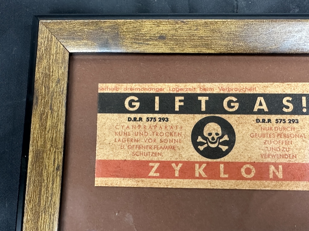 Zyklon B canister label in frame with holocaust photo Concentration Camp