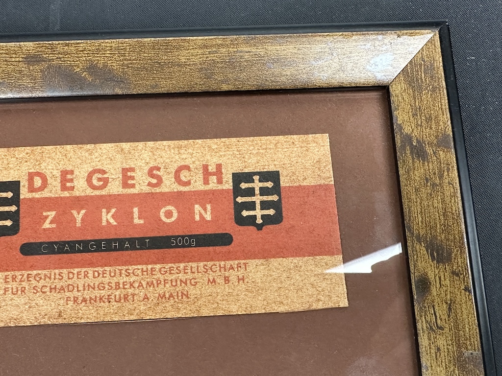 Zyklon B canister label in frame with holocaust photo Concentration Camp