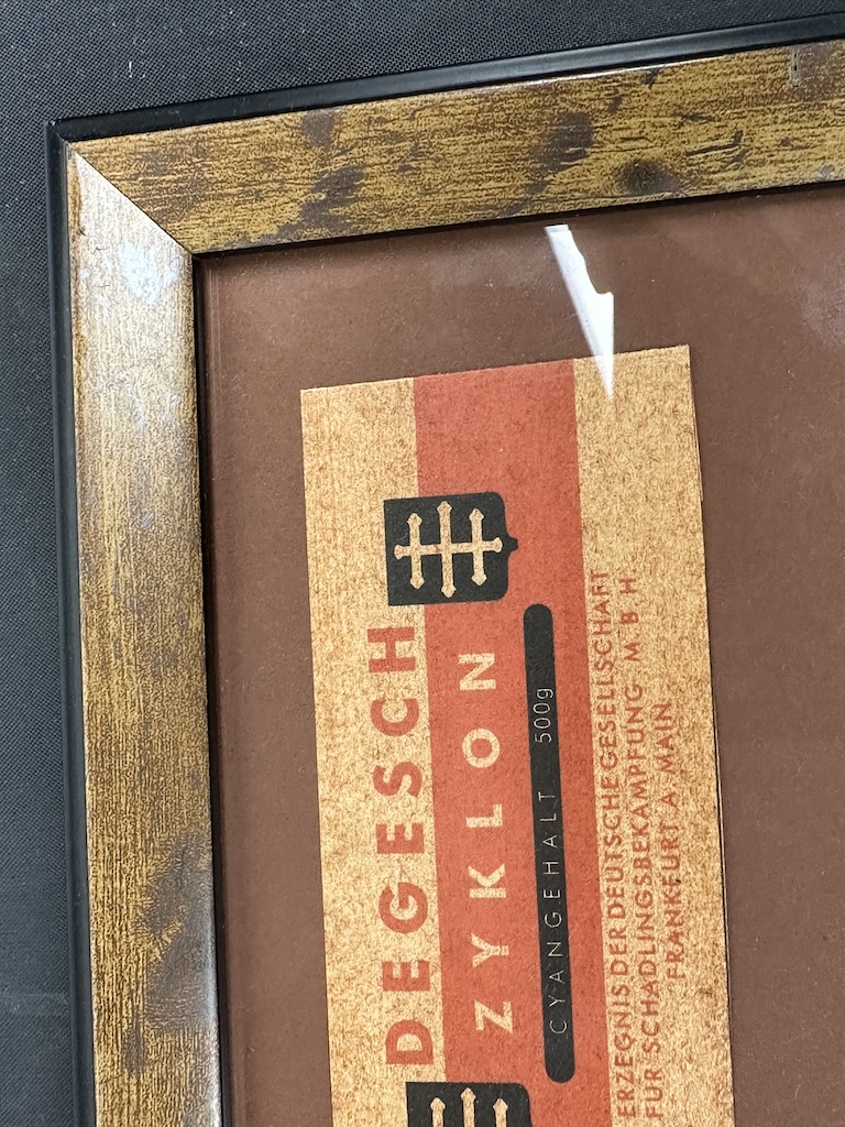 Zyklon B canister label in frame with holocaust photo Concentration Camp